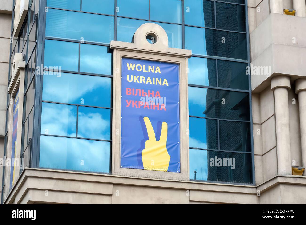 Blue and yellow poster with Wolna Ukraina Вільна Україна text and a ...