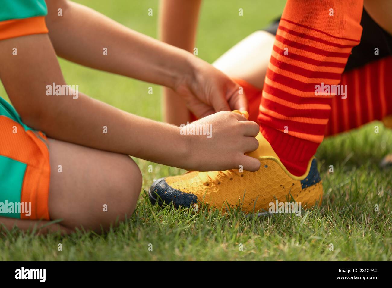 Soccer Boy Helping Teammate to Tie Laces. Friends in Sports Team. Kids ...