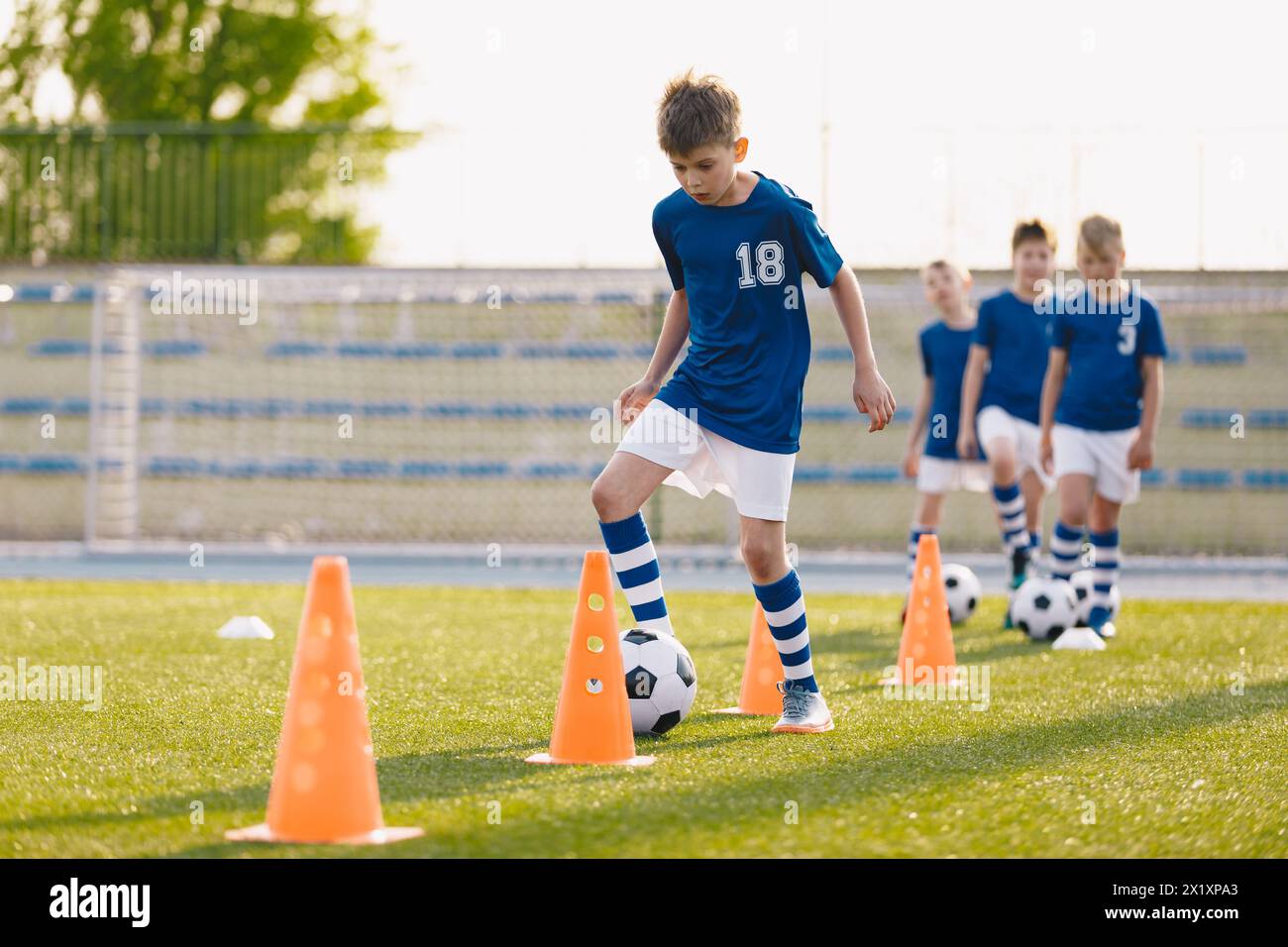 Happy Boys on Soccer Training Slalom Drill. School Kids Practicing ...