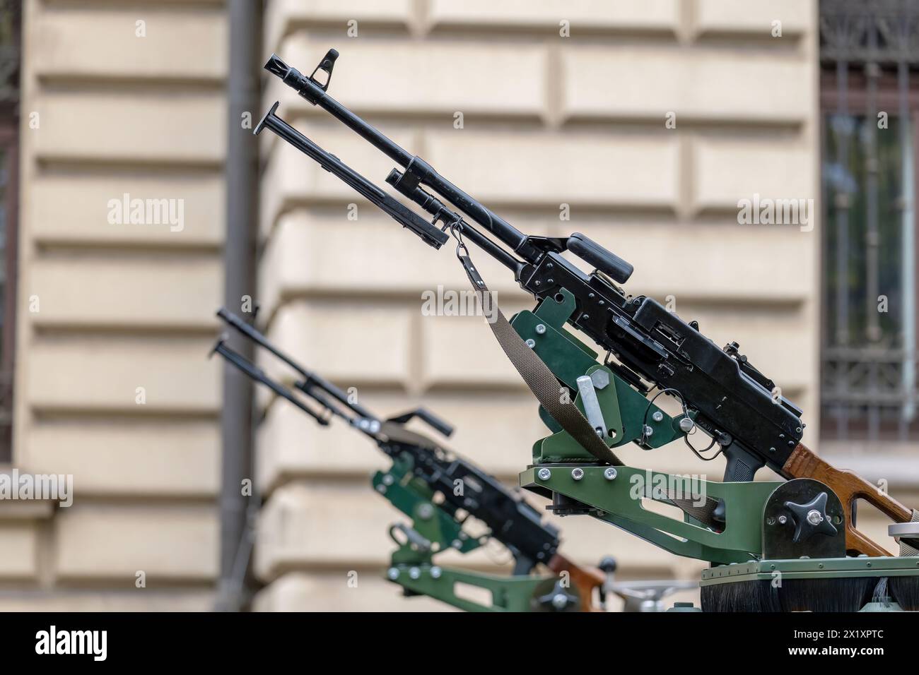 Closeup of a collection of vehicle-mounted machine guns with barrels ...