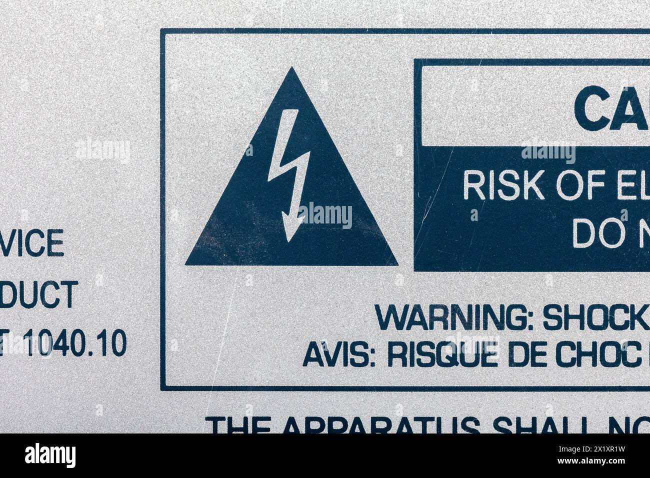 A close-up view of a bilingual warning label detailing the risk of ...