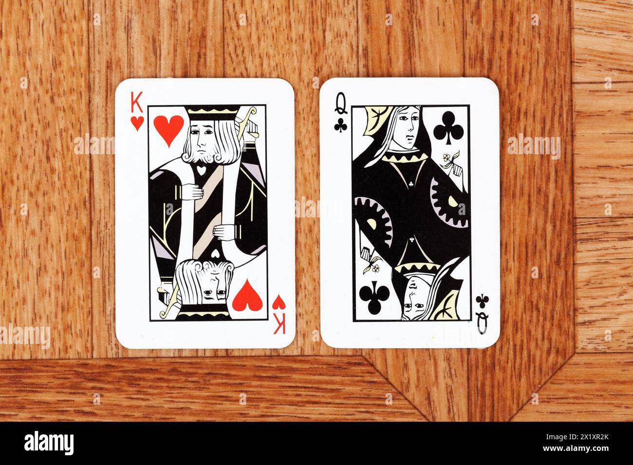 King of hearts card and Queen of clubs card placed side by side, facing ...