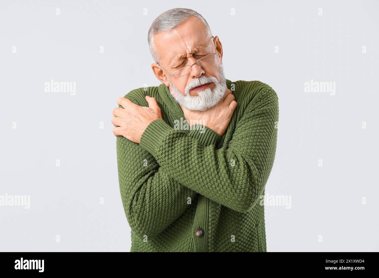 Ill old man with sore throat on white background Stock Photo - Alamy
