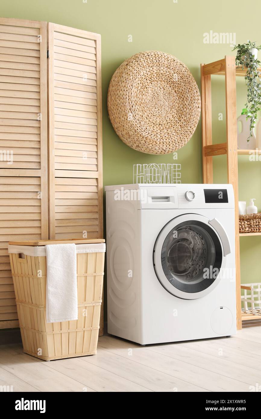 Modern washing machine with basket, shelving unit and dressing screen ...