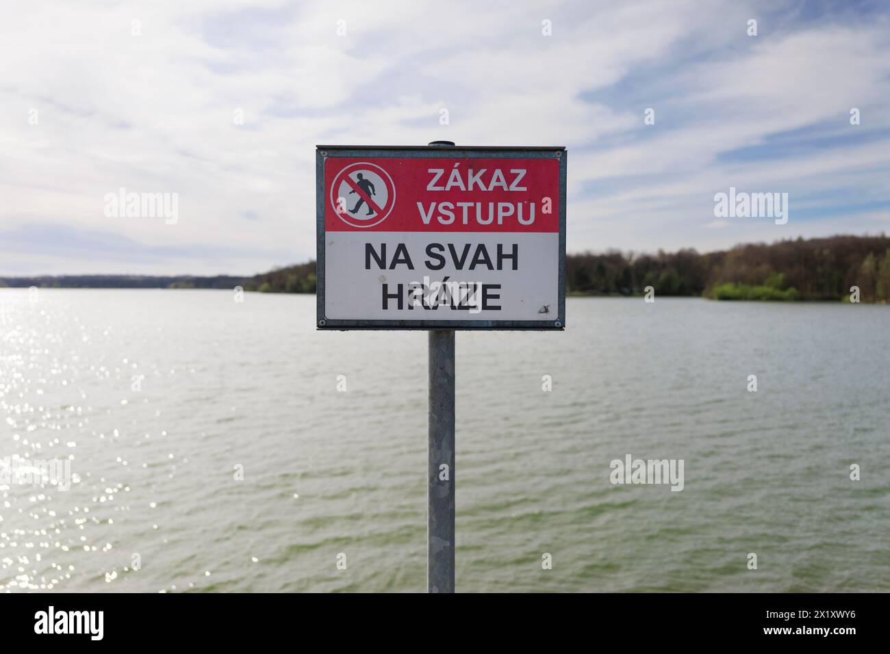 Warning sign with text - Do not enter on the dam embankment (translated ...