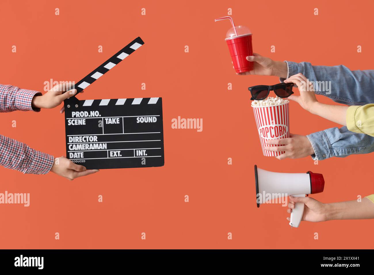 Many hands with bucket of popcorn, movie clapper and megaphone on ...