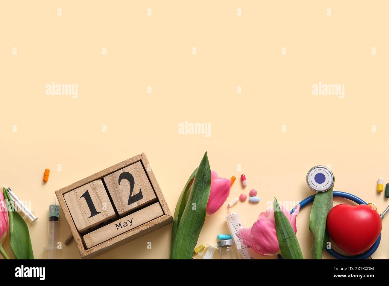 Stethoscope with flowers, syringes and calendar for International ...