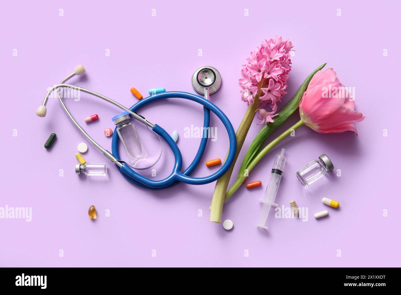 Stethoscope with ampules, pills and flowers for International Nurses ...