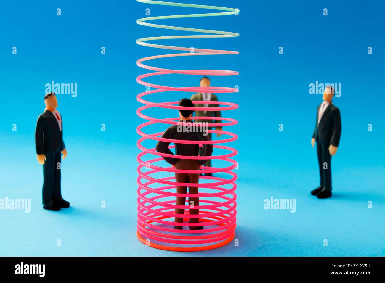 Group of men gathered where one of them is isolated inside a ...