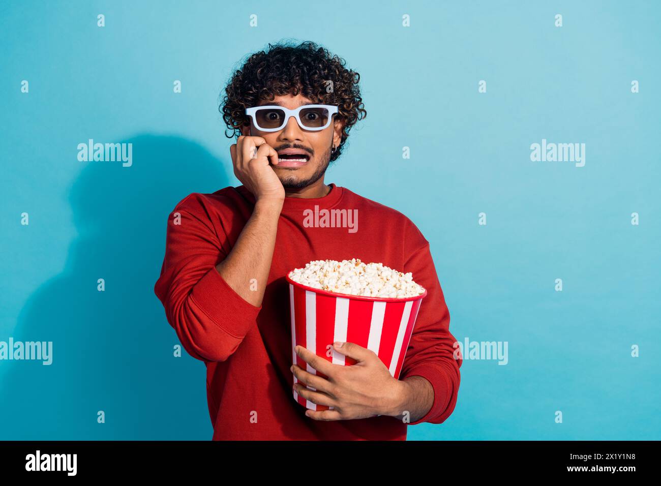 Photo of young funny guy mexican fear biting nails scared watching ...