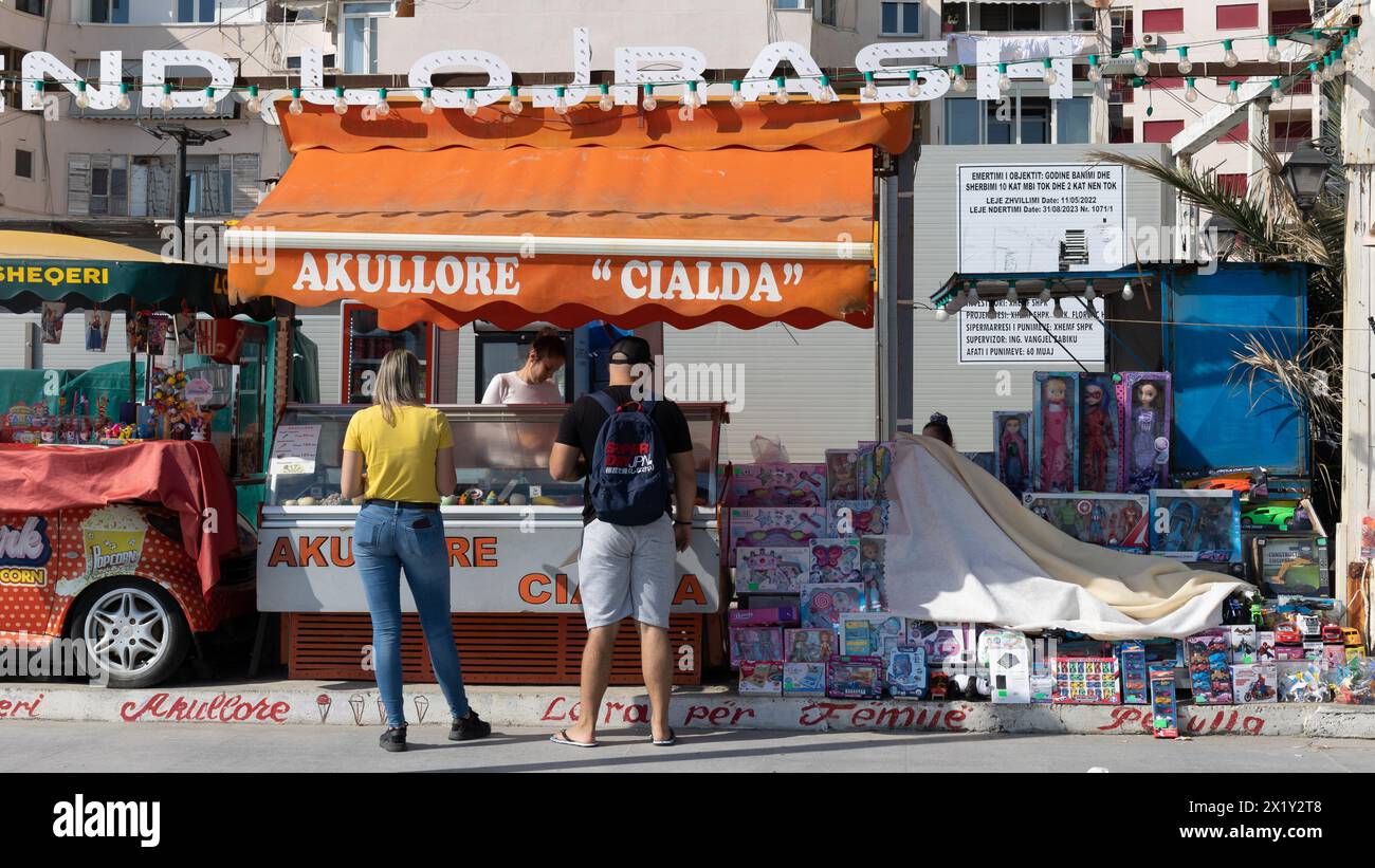Photo of two people buying ice cream in a small shop by the roadside ...
