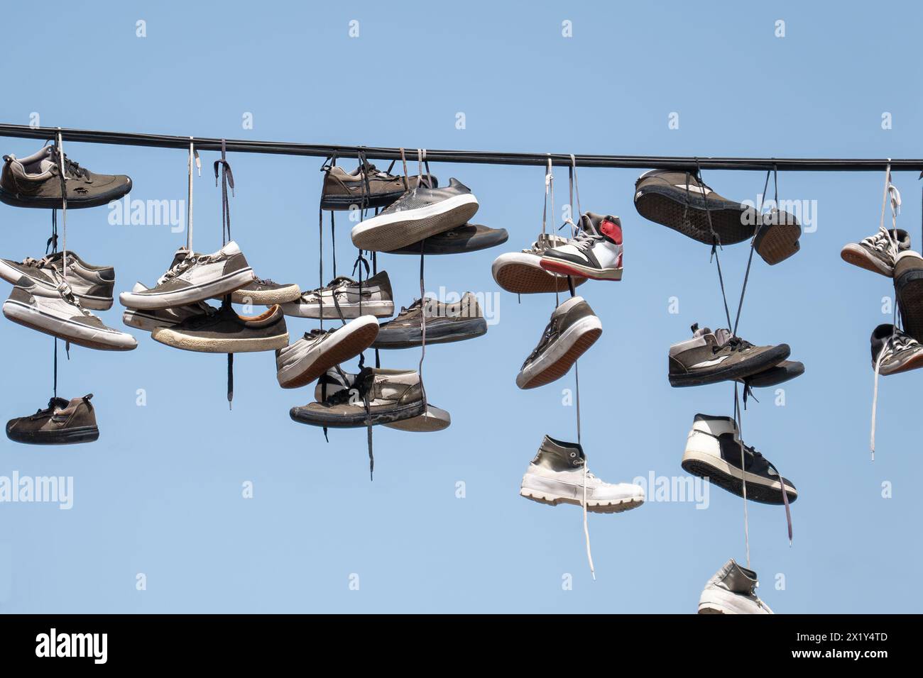 Shoes on electricity wire hi-res stock photography and images - Alamy