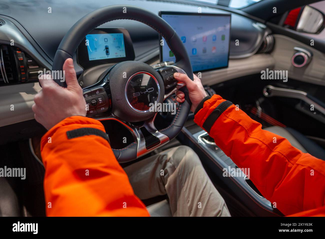 man in car driving BYD ATTO 3 Car Electric Car, male hand on button ...