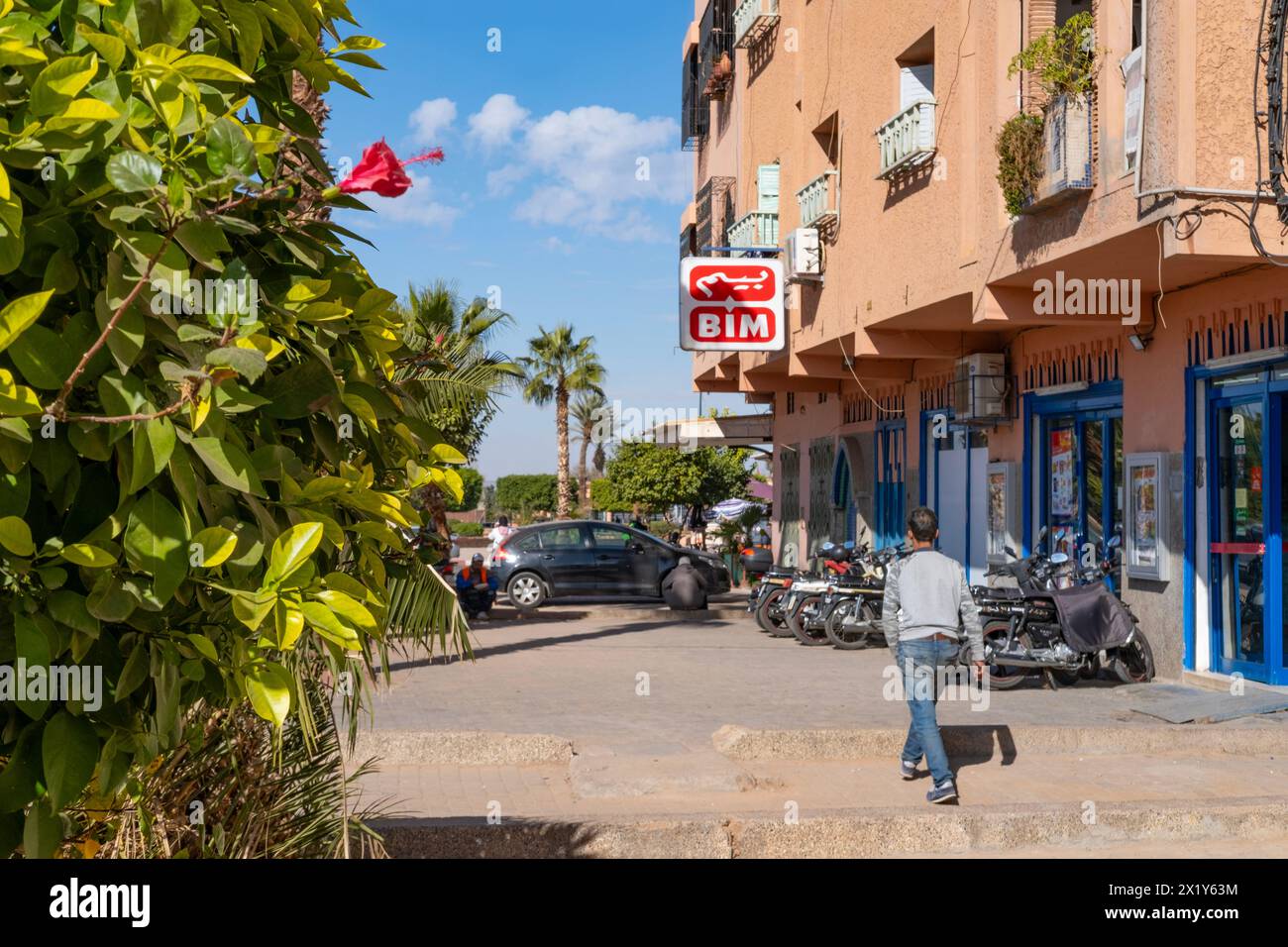 man walking into popular Moroccan grocery store BIM Store, lively ...