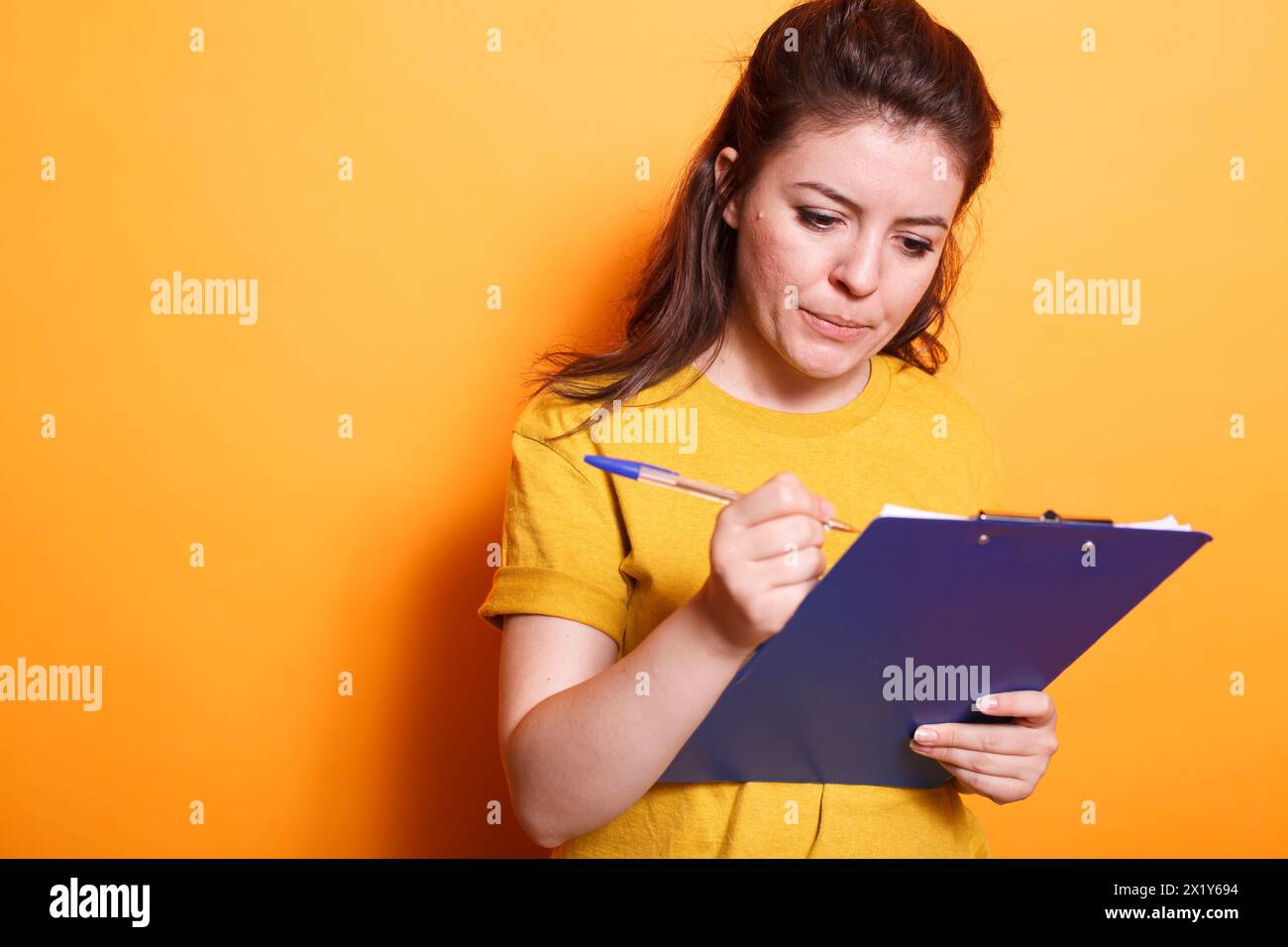 Woman going through paperwork using hi-res stock photography and images ...