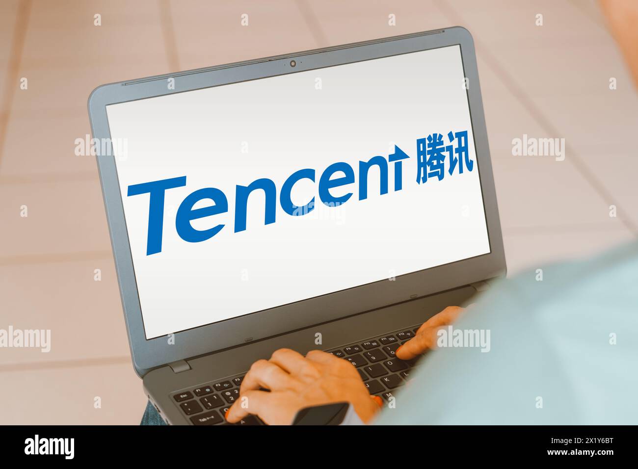 In this photo illustration, the Tencent logo is seen displayed on a ...