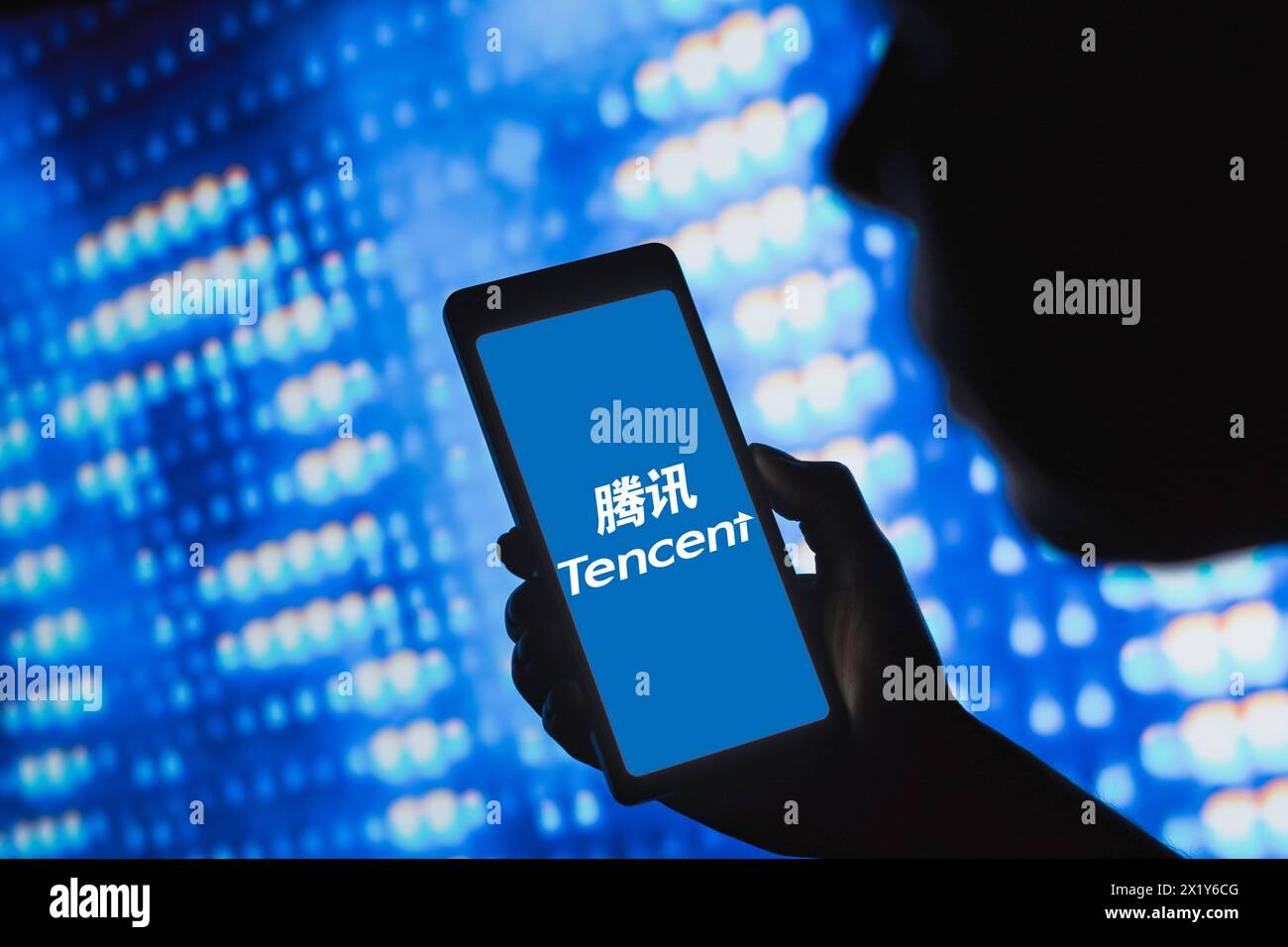 In this photo illustration, the Tencent logo is displayed on a ...