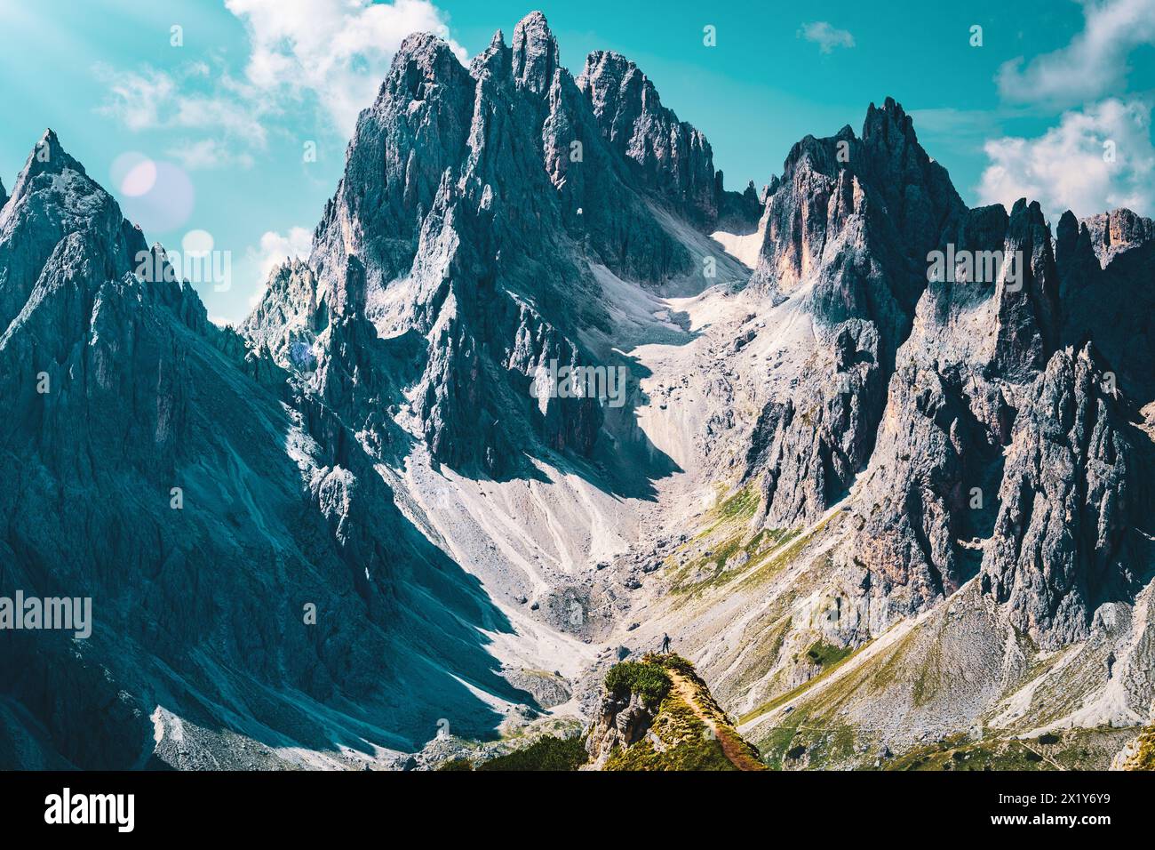 Description: Athletic woman walks on super epic view point with Cadini ...