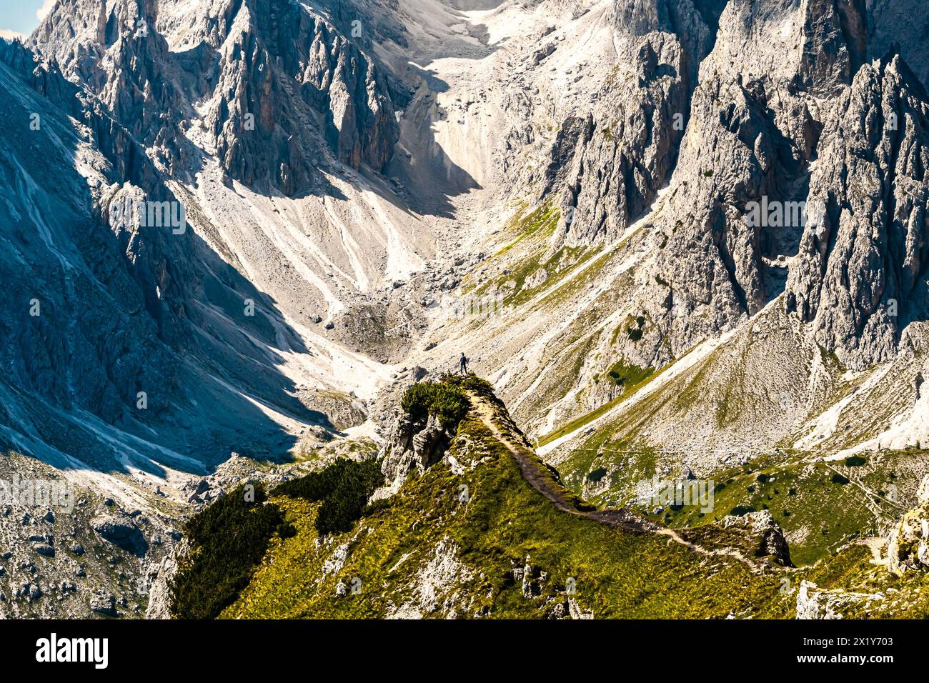 Description: Athletic woman walks on super epic view point with Cadini ...