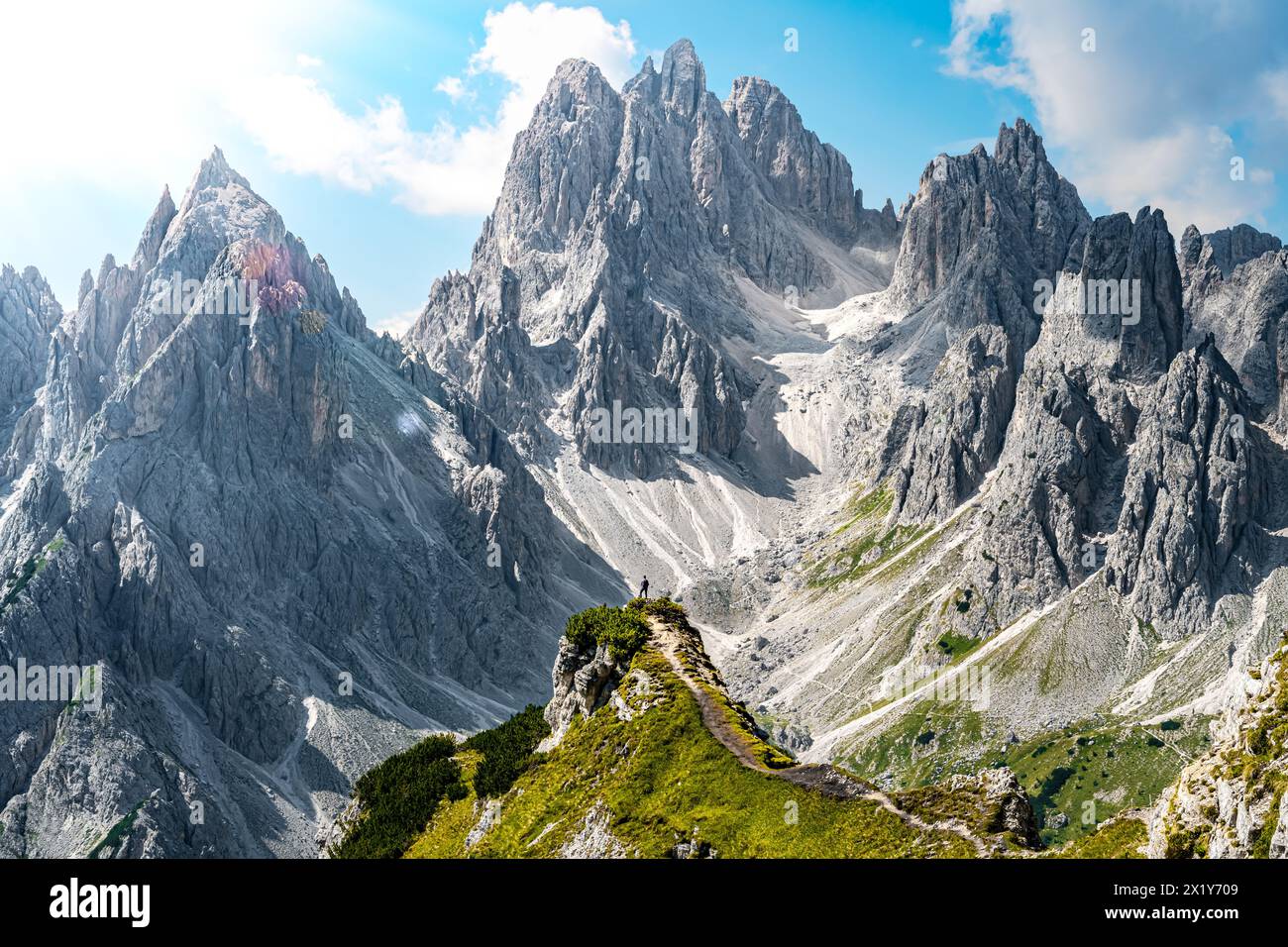 Description: Athletic woman walks on super epic view point with Cadini ...