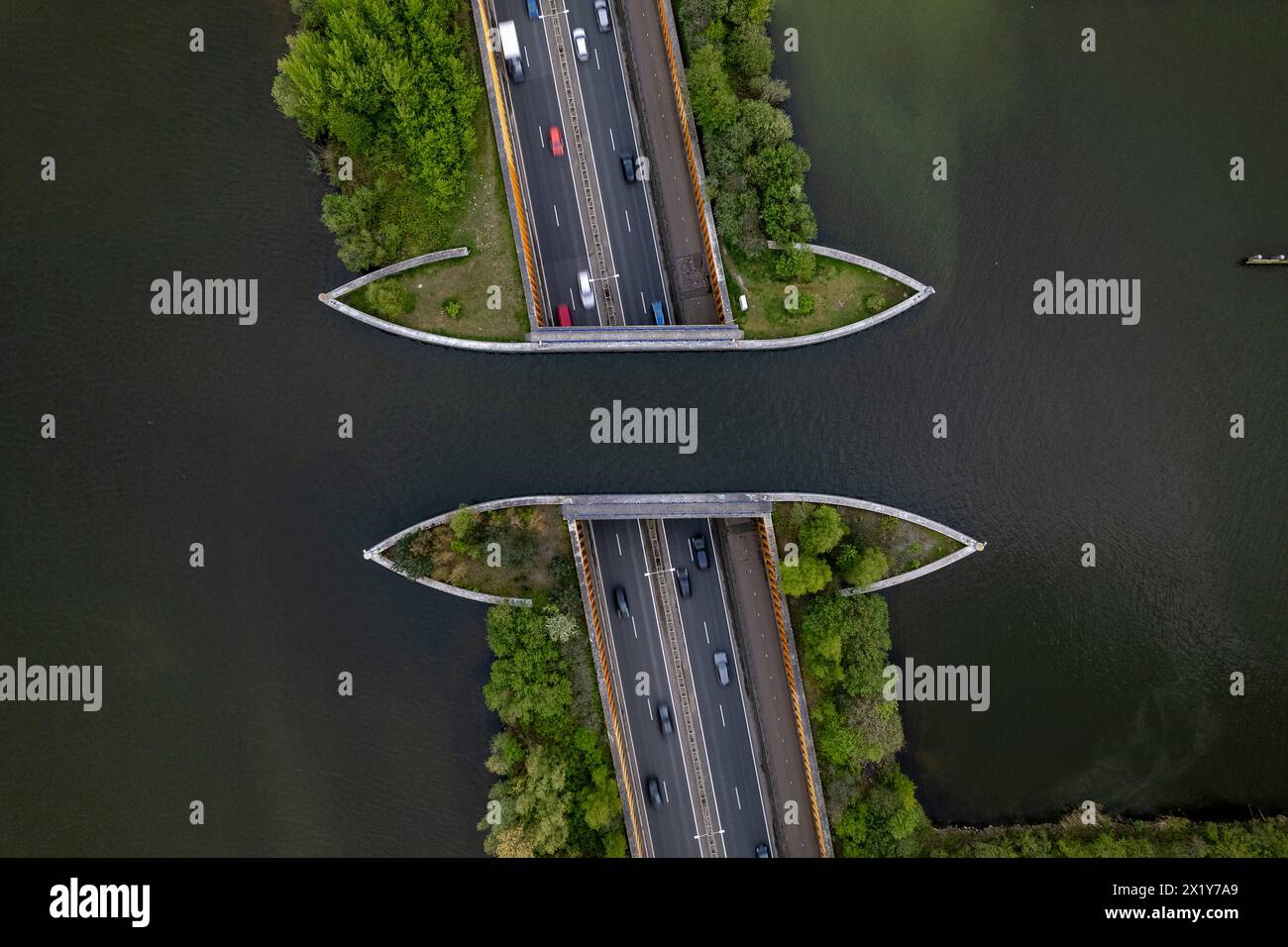 Highway with traffic passing underneath Veluwemeer aquaduct seen from ...
