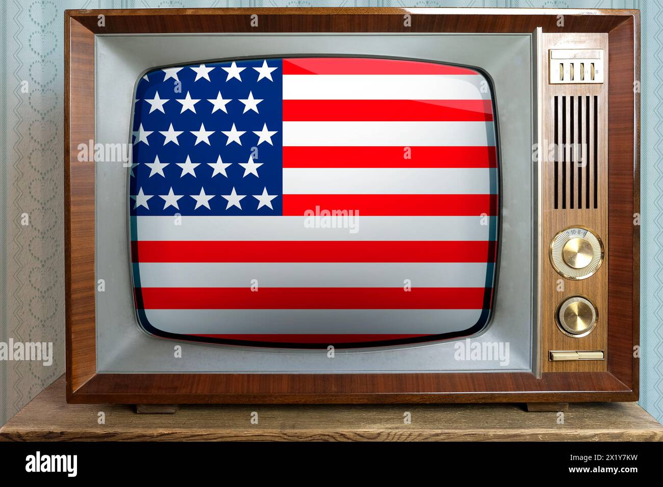 old tube vintage TV with the national flag of the USA on the screen ...