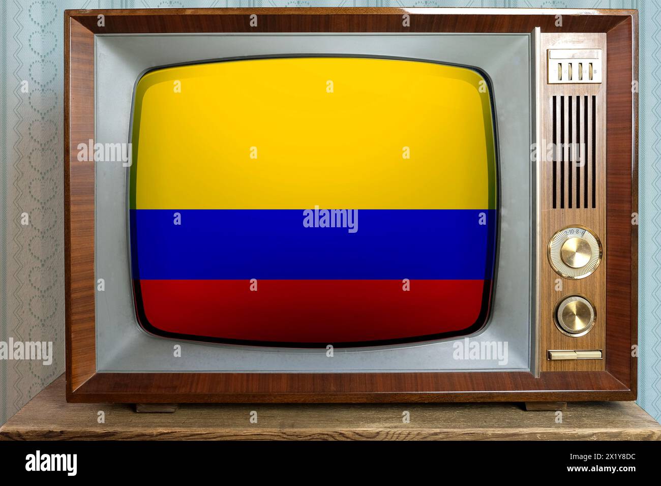 old tube vintage TV with the national flag of Colombia on the screen ...