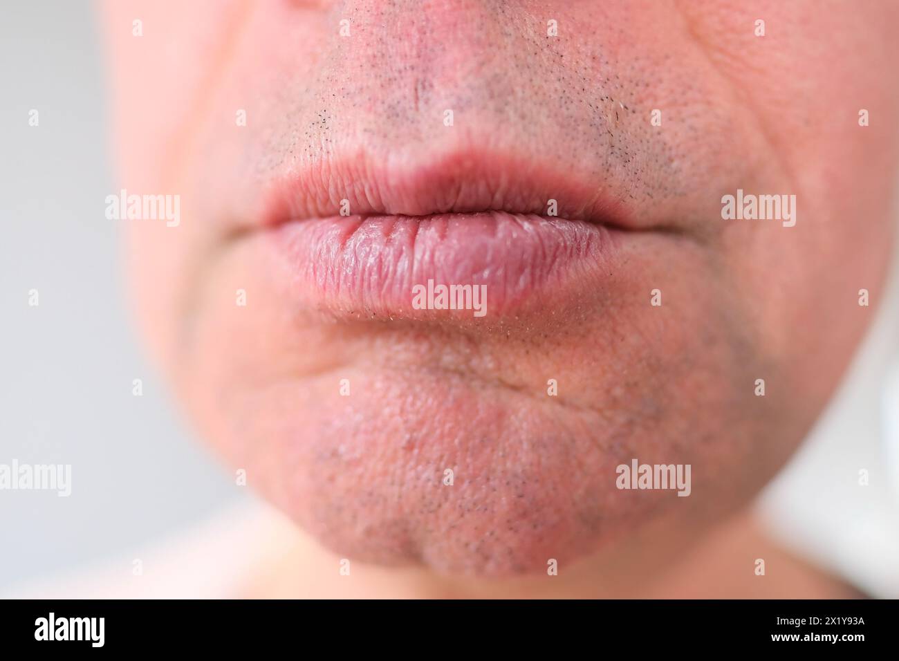 close-up and front view of mouth of an old caucasian man in his sixties ...