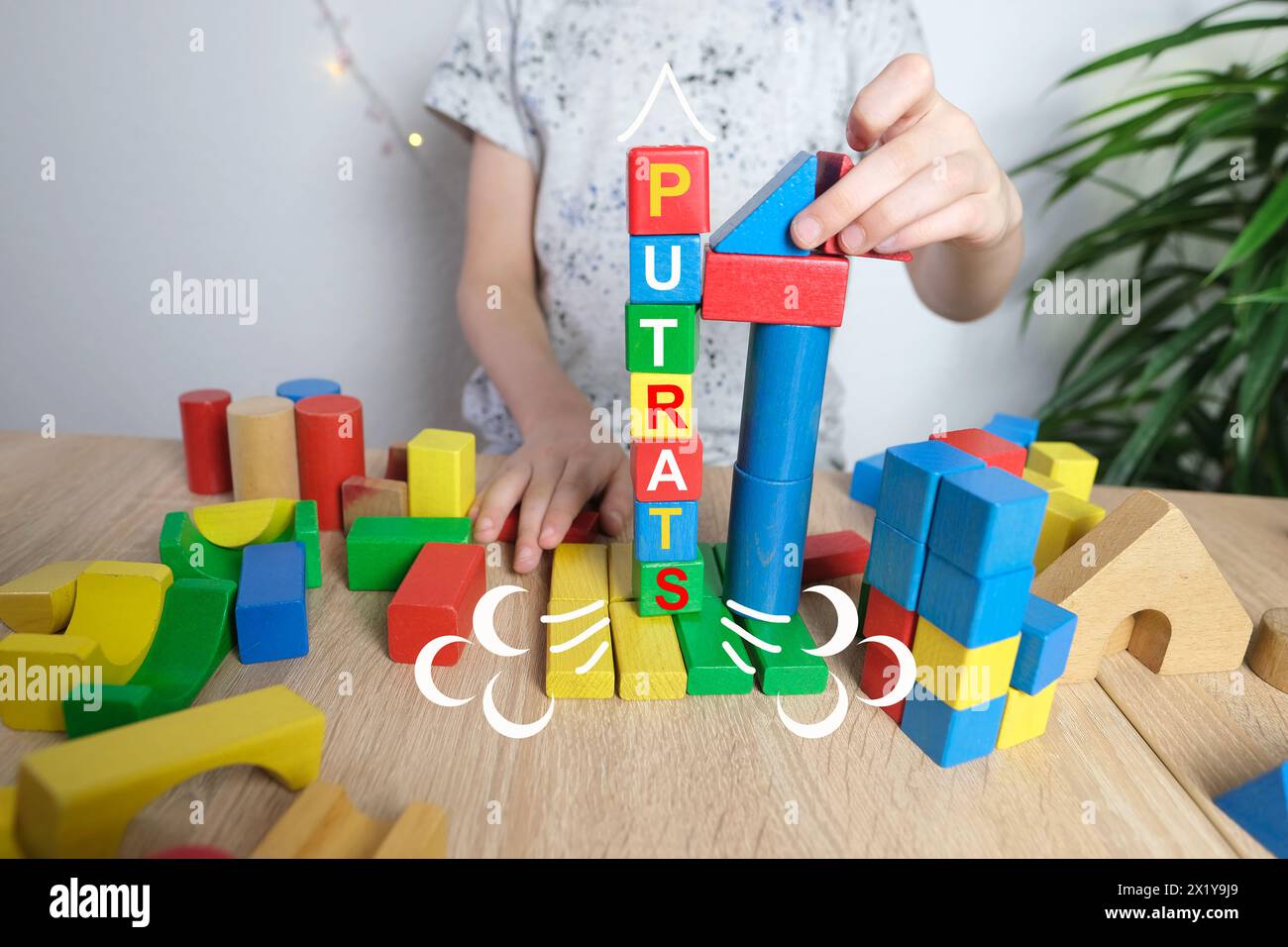 child, kid plays with colored wooden cubes, builds rocket, startup ...