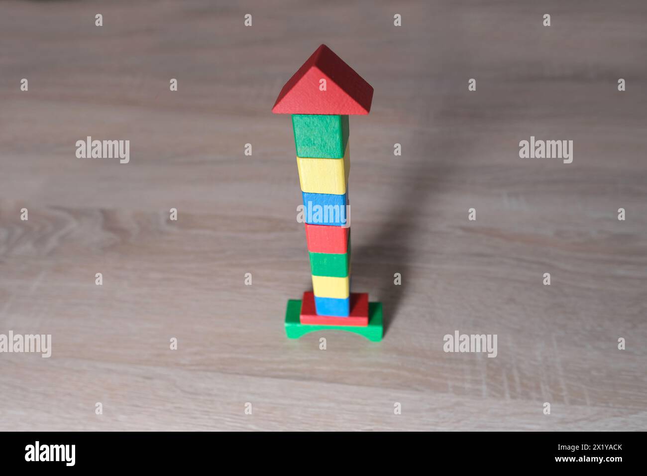colored wooden cubes, builds houses and rockets, the concept of the ...