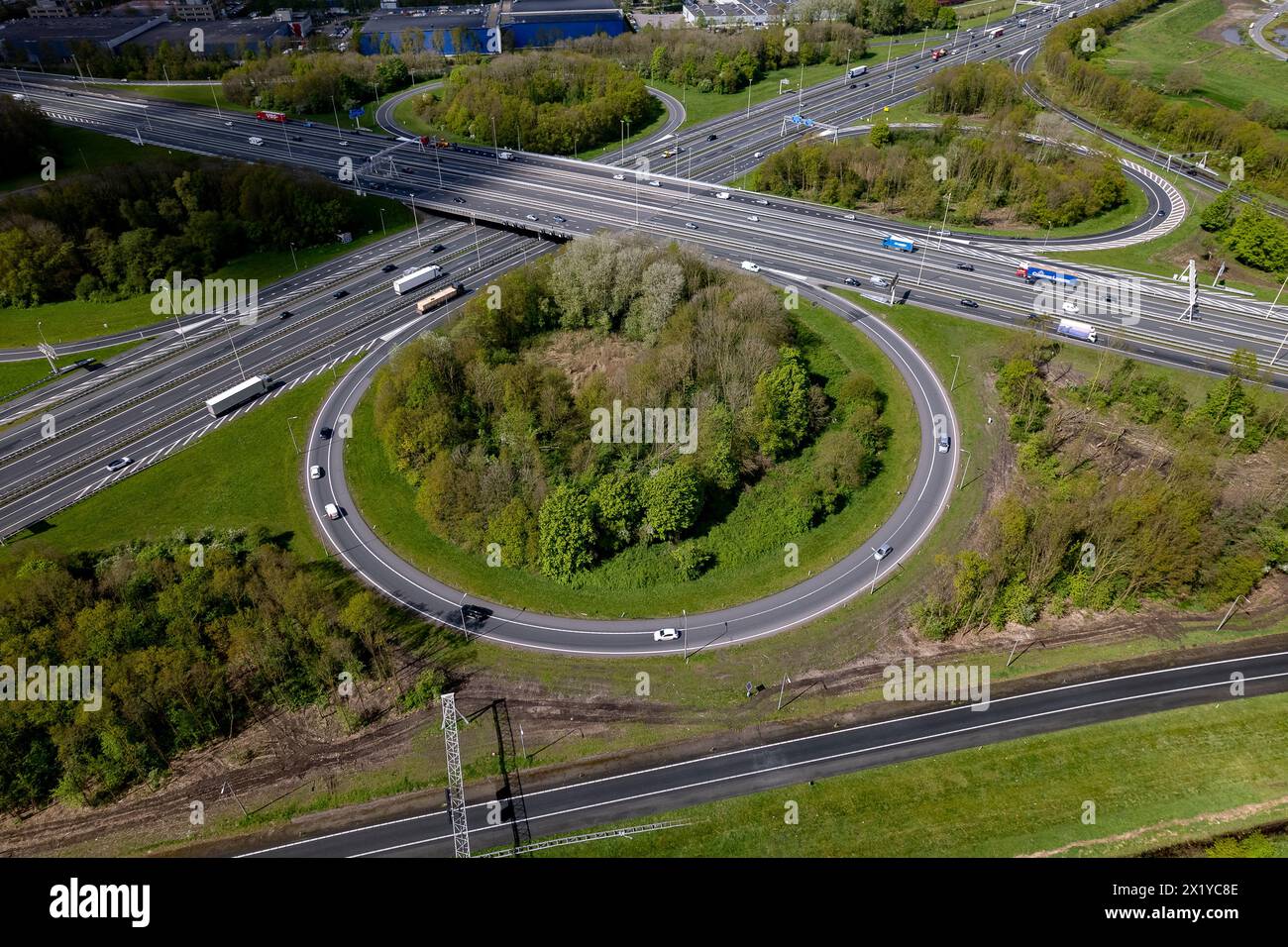 Aerial overview of dramatic clouds above transit roundabout Hoevelaken ...