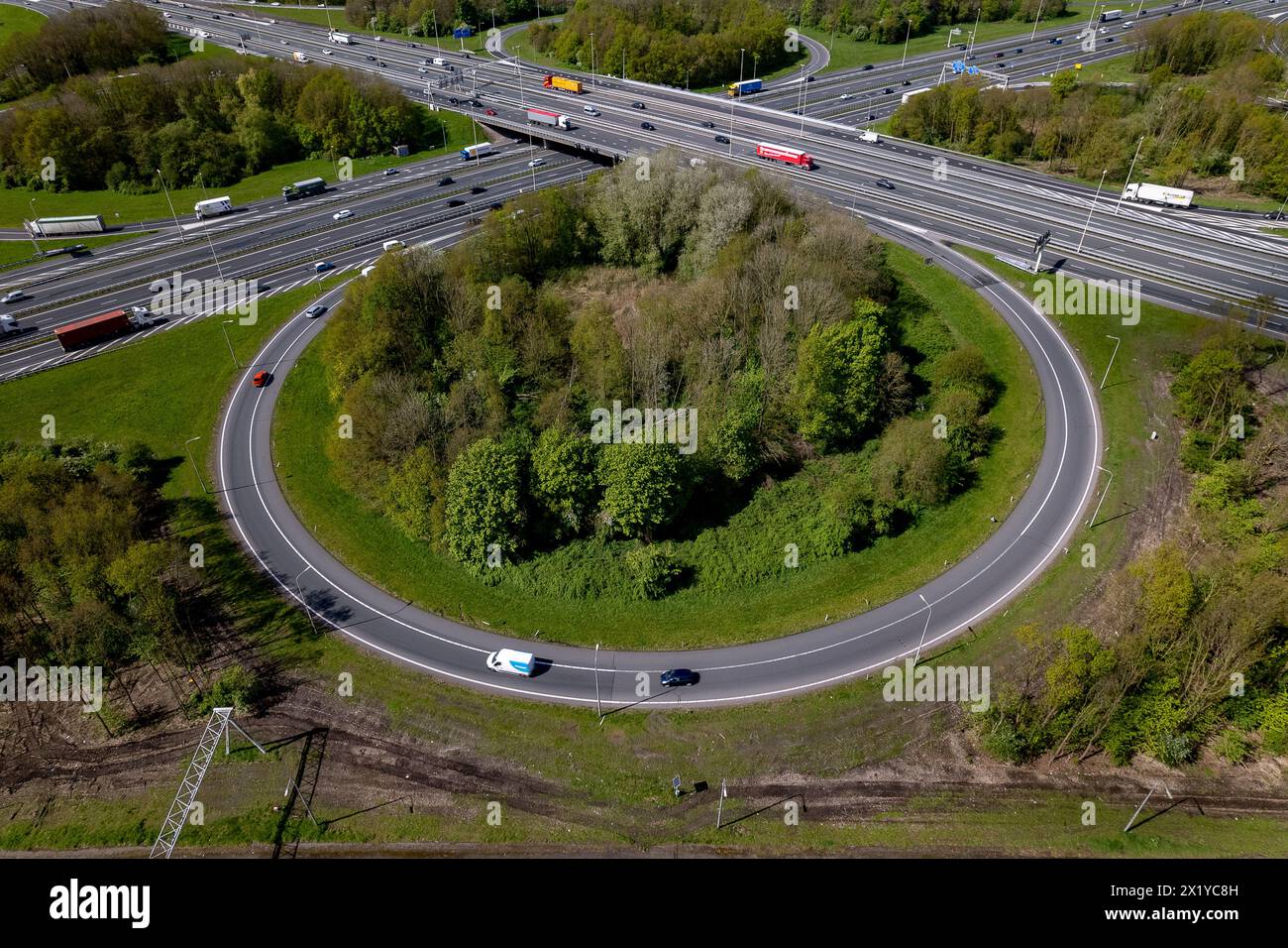 Aerial overview of dramatic clouds above transit roundabout Hoevelaken ...
