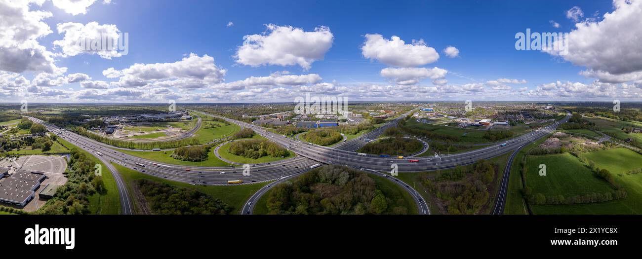 Aerial overview of dramatic clouds above transit roundabout Hoevelaken ...
