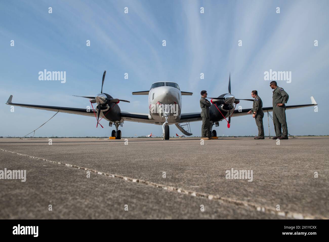 A T-54A multi-engine aircraft sits on the flight line of Naval Air ...