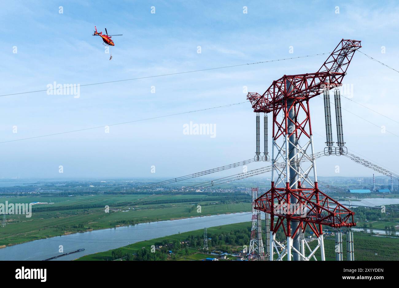 HUAINAN, CHINA - APRIL 18, 2024 - A helicopter lifts maintenance ...