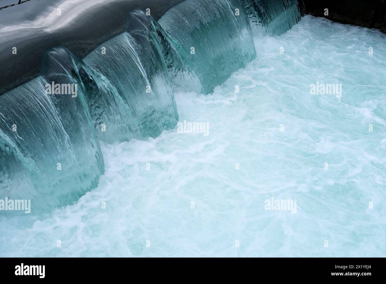 streams of water seethe in powerful waterfall, historic dam on Reuss ...