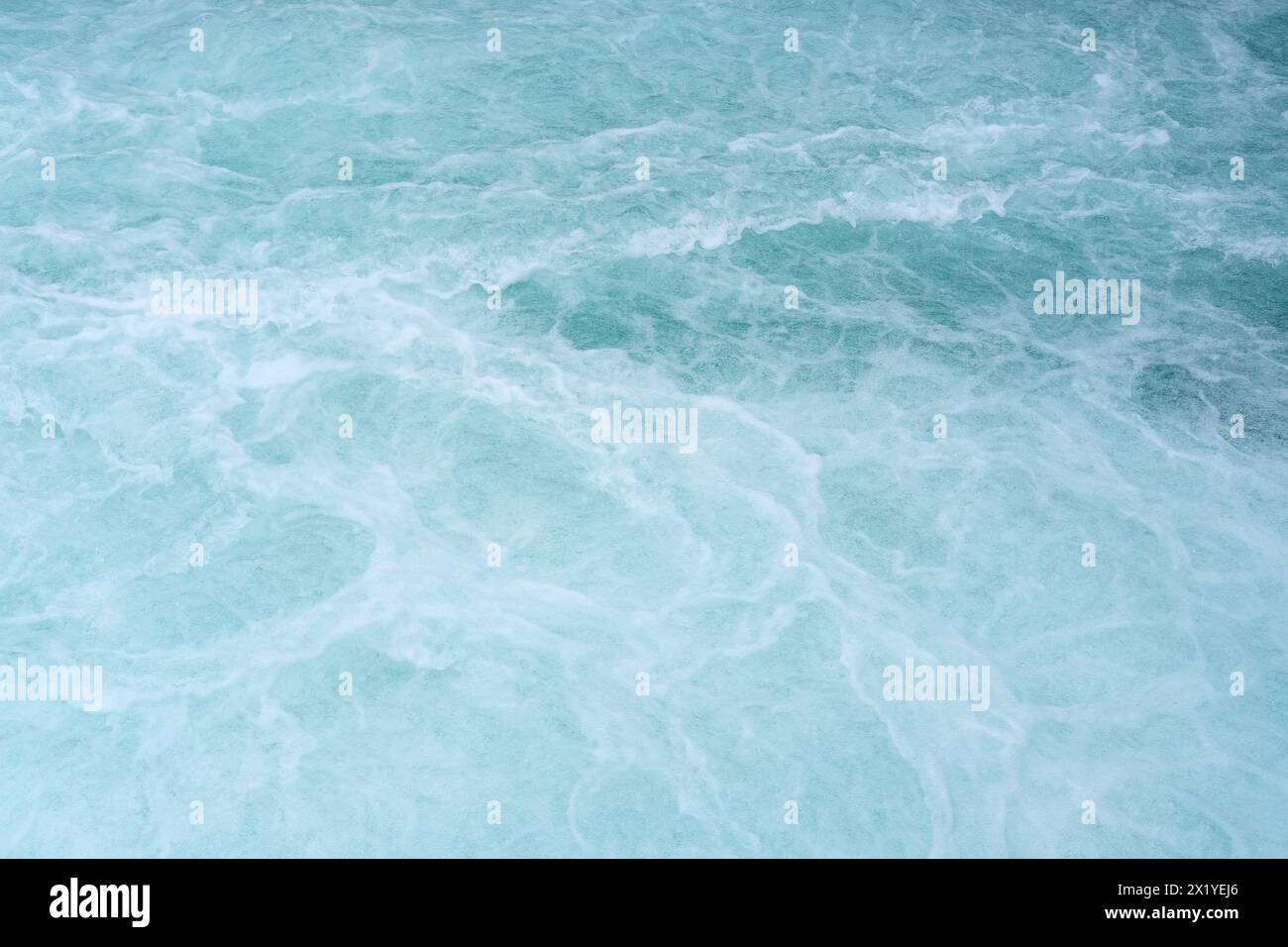 streams of water seethe in powerful waterfall, historic dam on Reuss ...