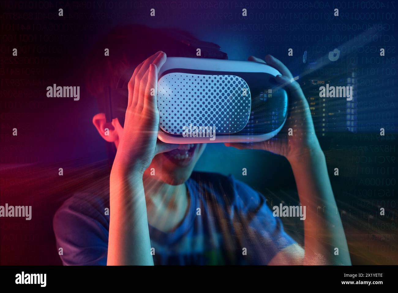 boy, child in dark room with neon lights in modern VR glasses ...