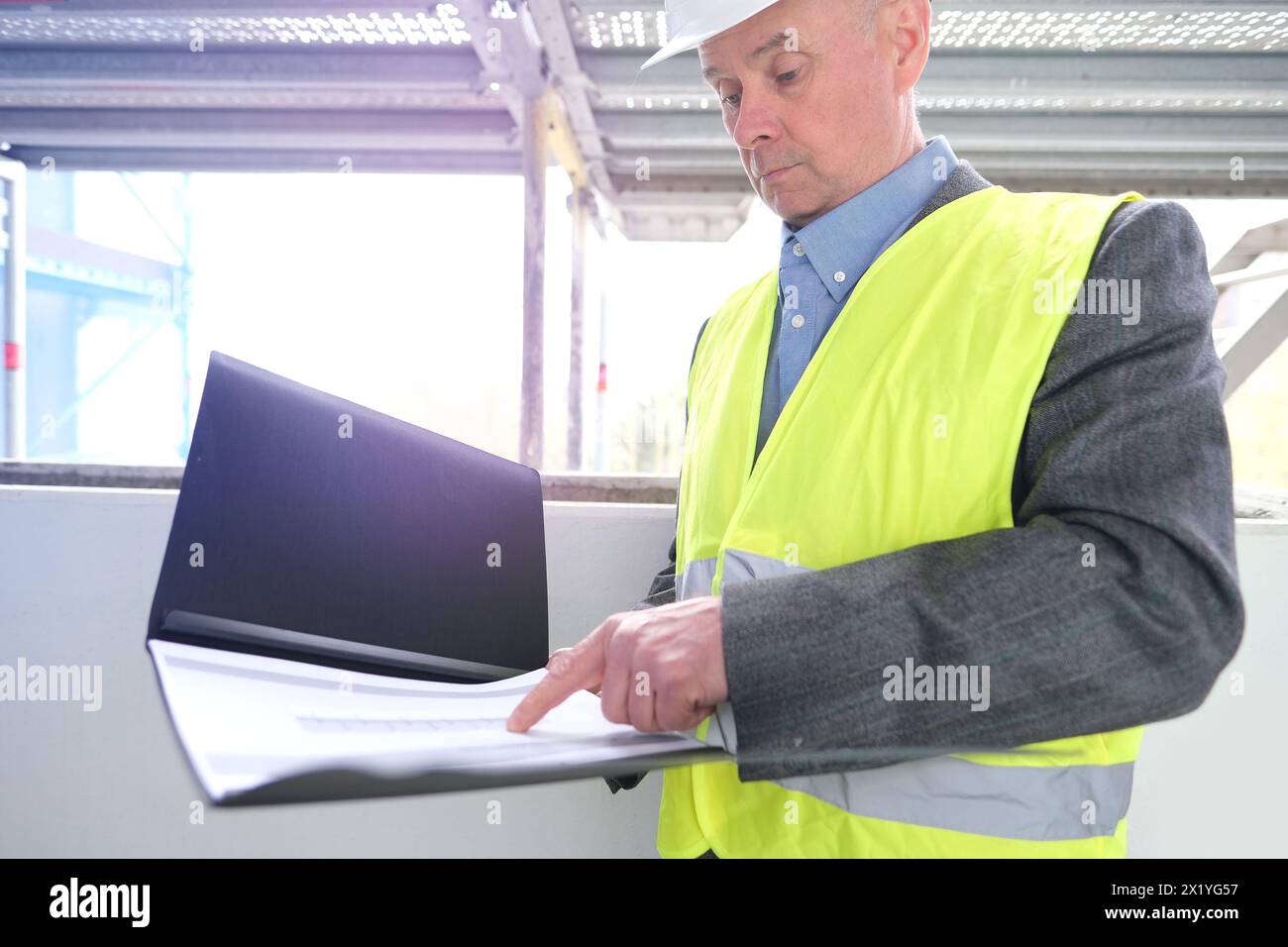 experienced elderly builder, construction team leader, construction ...