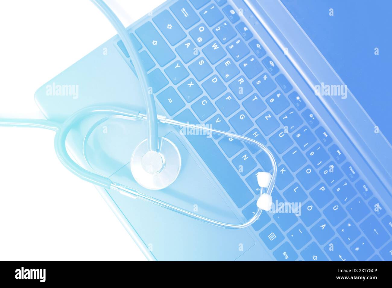 medical stethoscope, the doctor's tool lies on the laptop keyboard, the ...