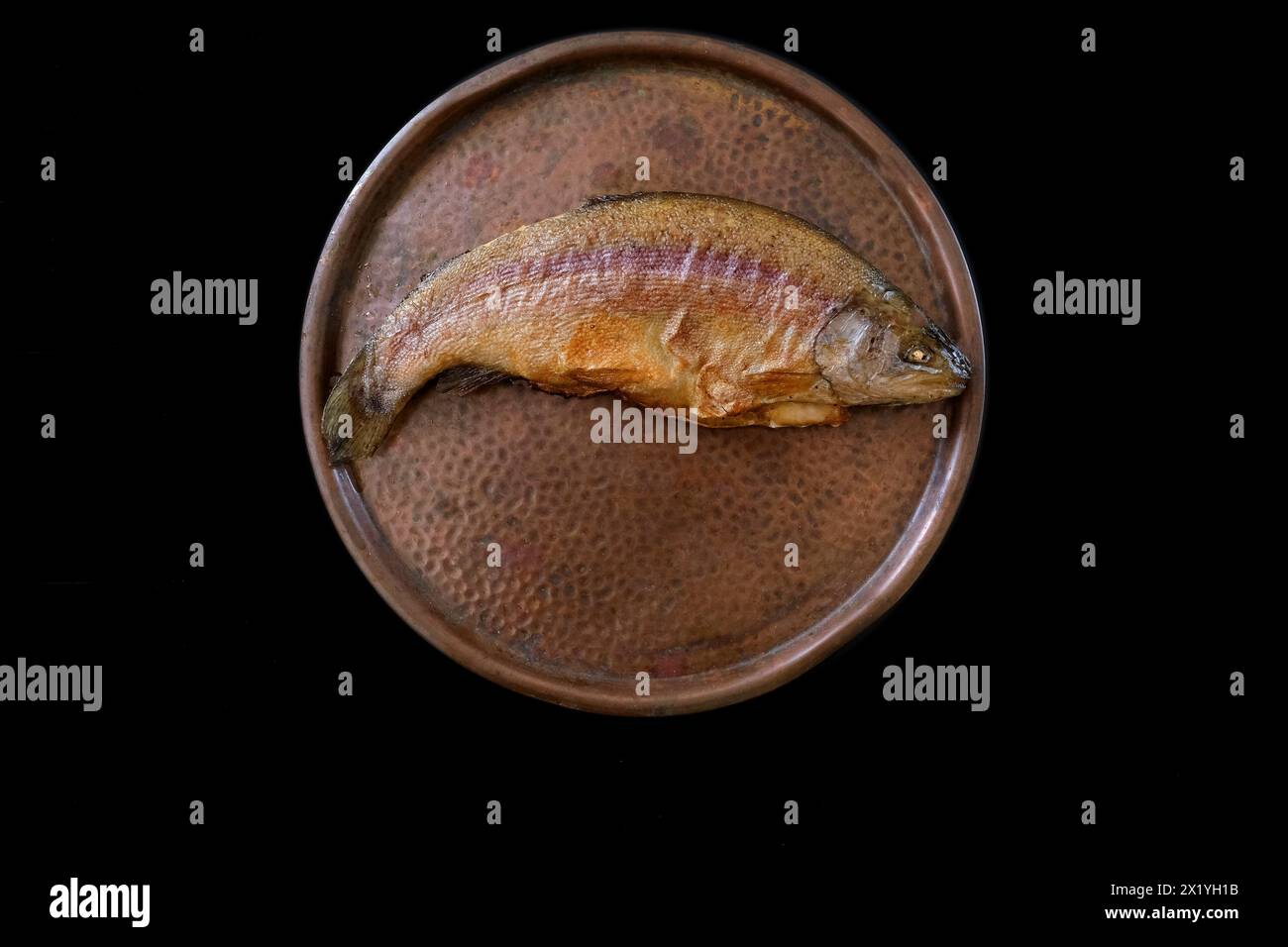 closeup fried river fish rainbow trout, Oncorhynchus mykiss lies on a ...