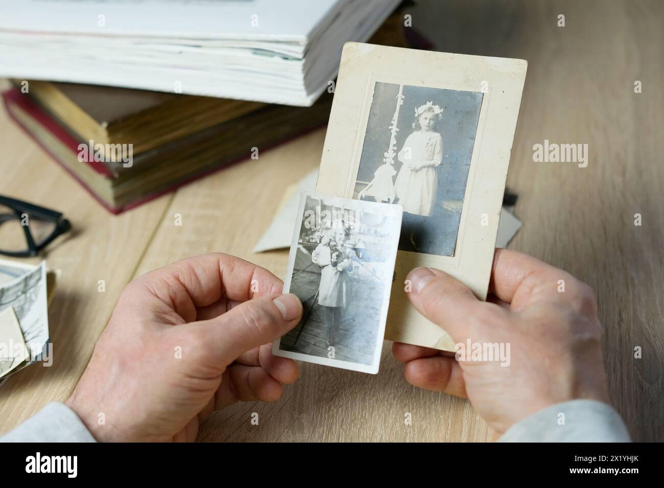 closeup male hand holding old vintage photos of 1940-1950, concept of ...