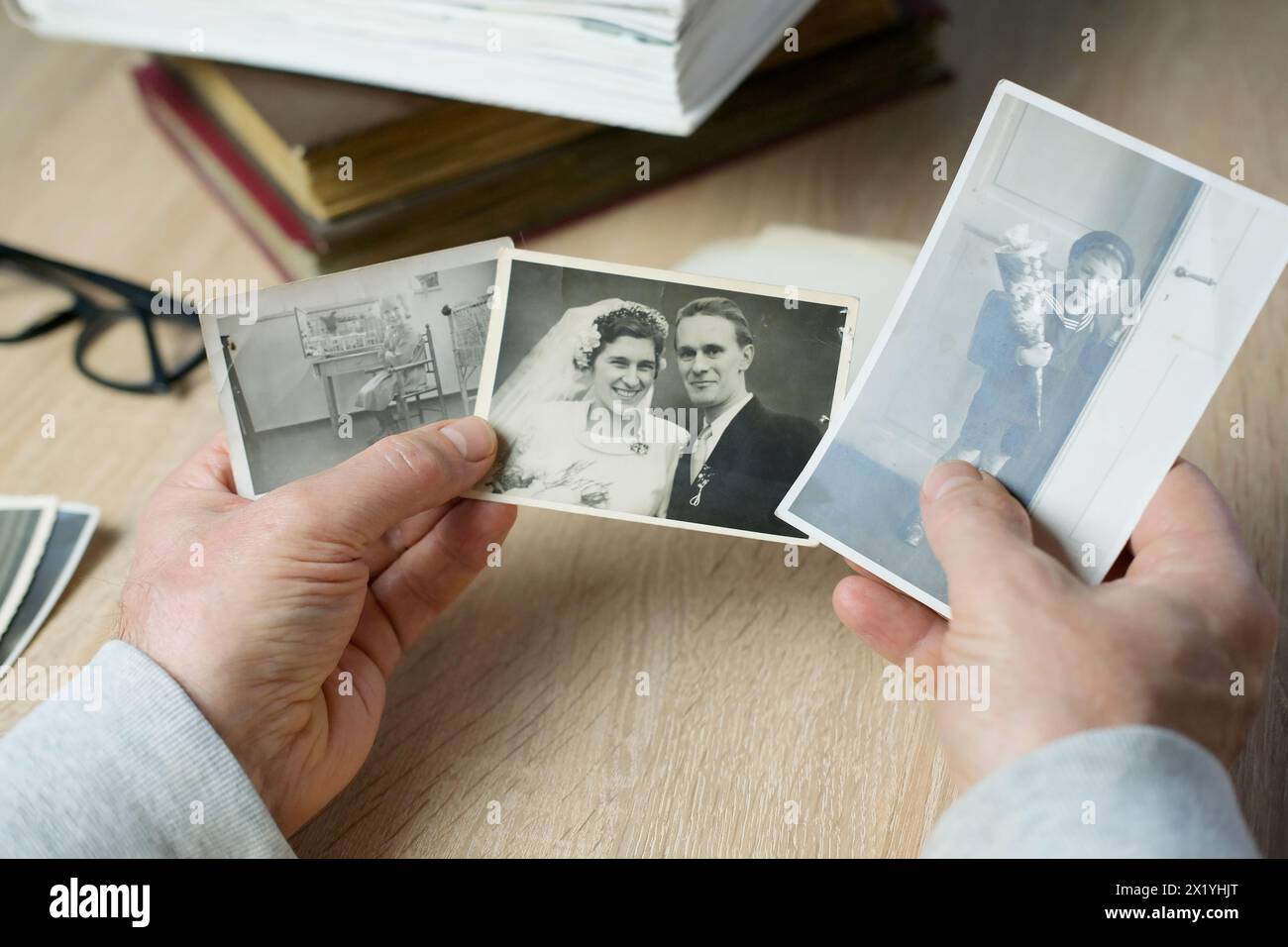 closeup male hand holding old vintage photos of 1940-1950, concept of ...