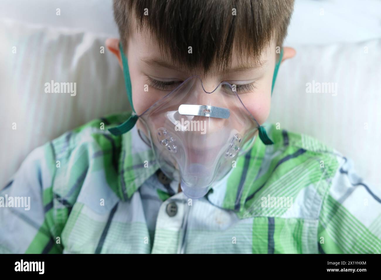 little patient in shirt, child, boy lies, facial oxygen mask, concept ...