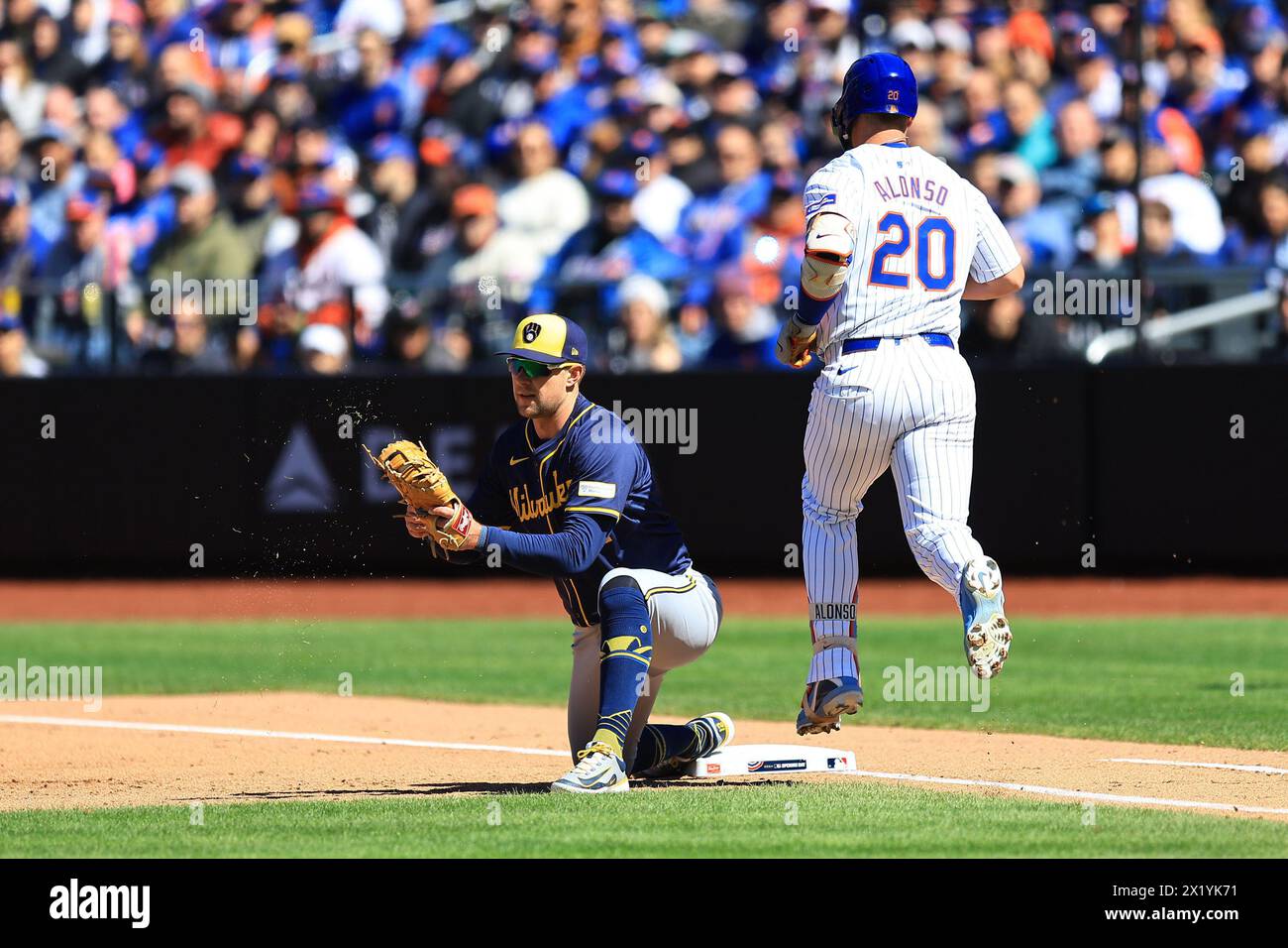 Milwaukee Brewers 1B Rhys Hoskins #12 scoops ball up as New York Mets ...
