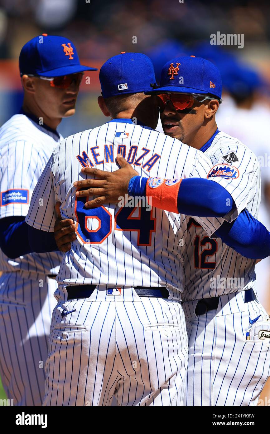 New York Mets Francisco Lindor #12 embraces manager Carlos Mendoza #64 ...