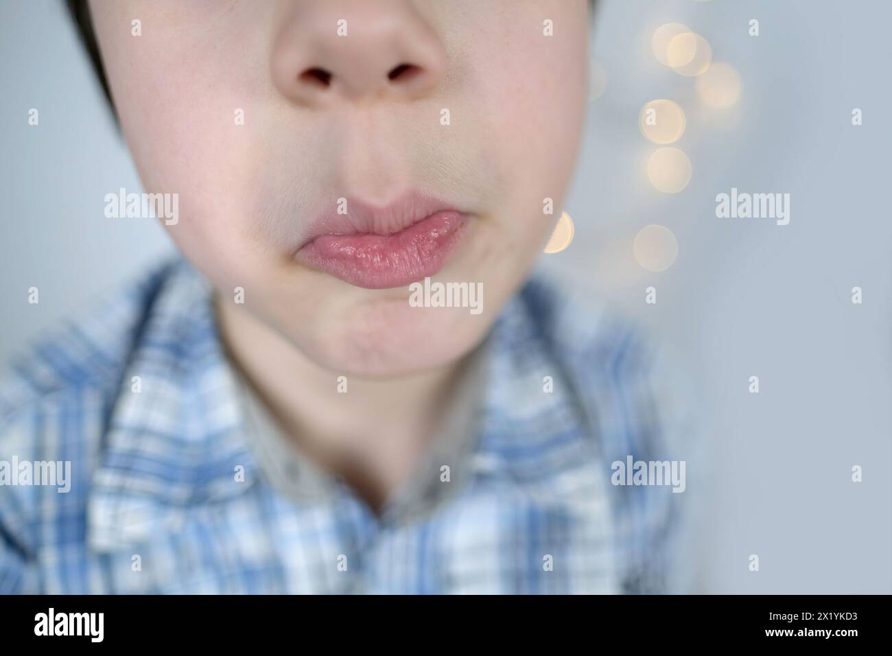 funny face of small child, kid performs articulation exercises for ...