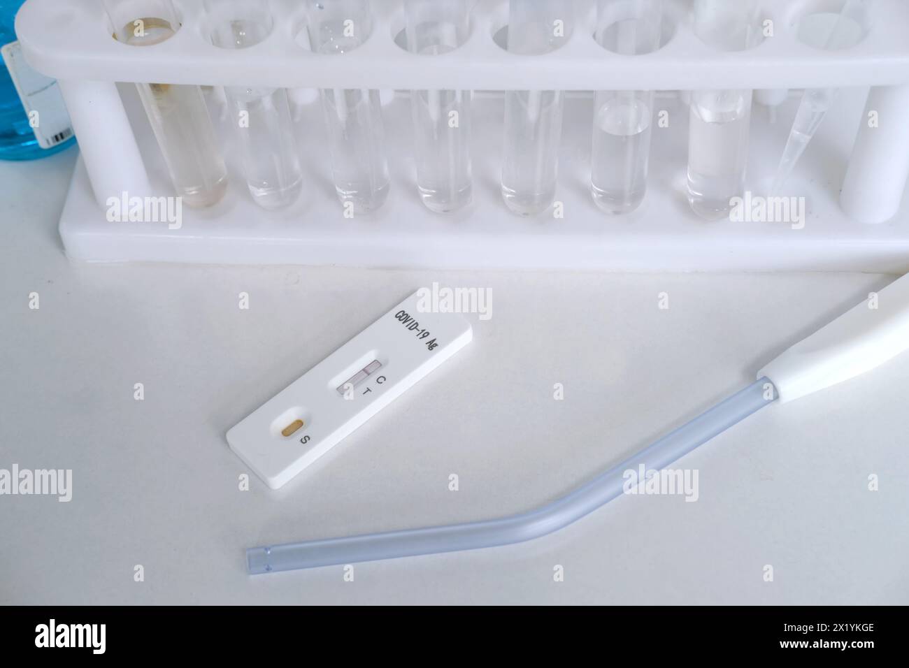 antigenic test cassette, glass test tubes with reagents, conducting a ...