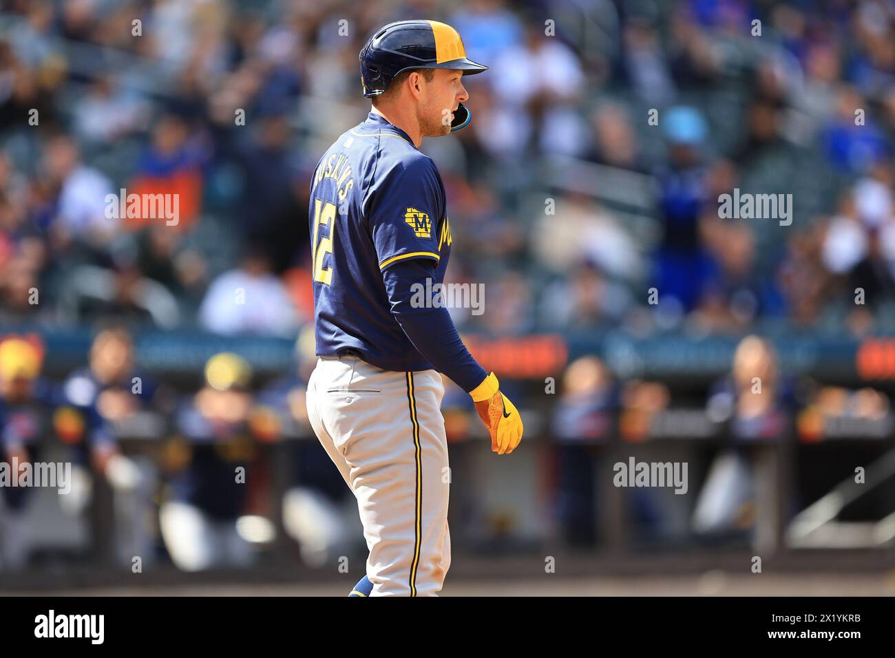 Milwaukee Brewers Rhys Hoskins #12 reacts after being nearly hit by a ...