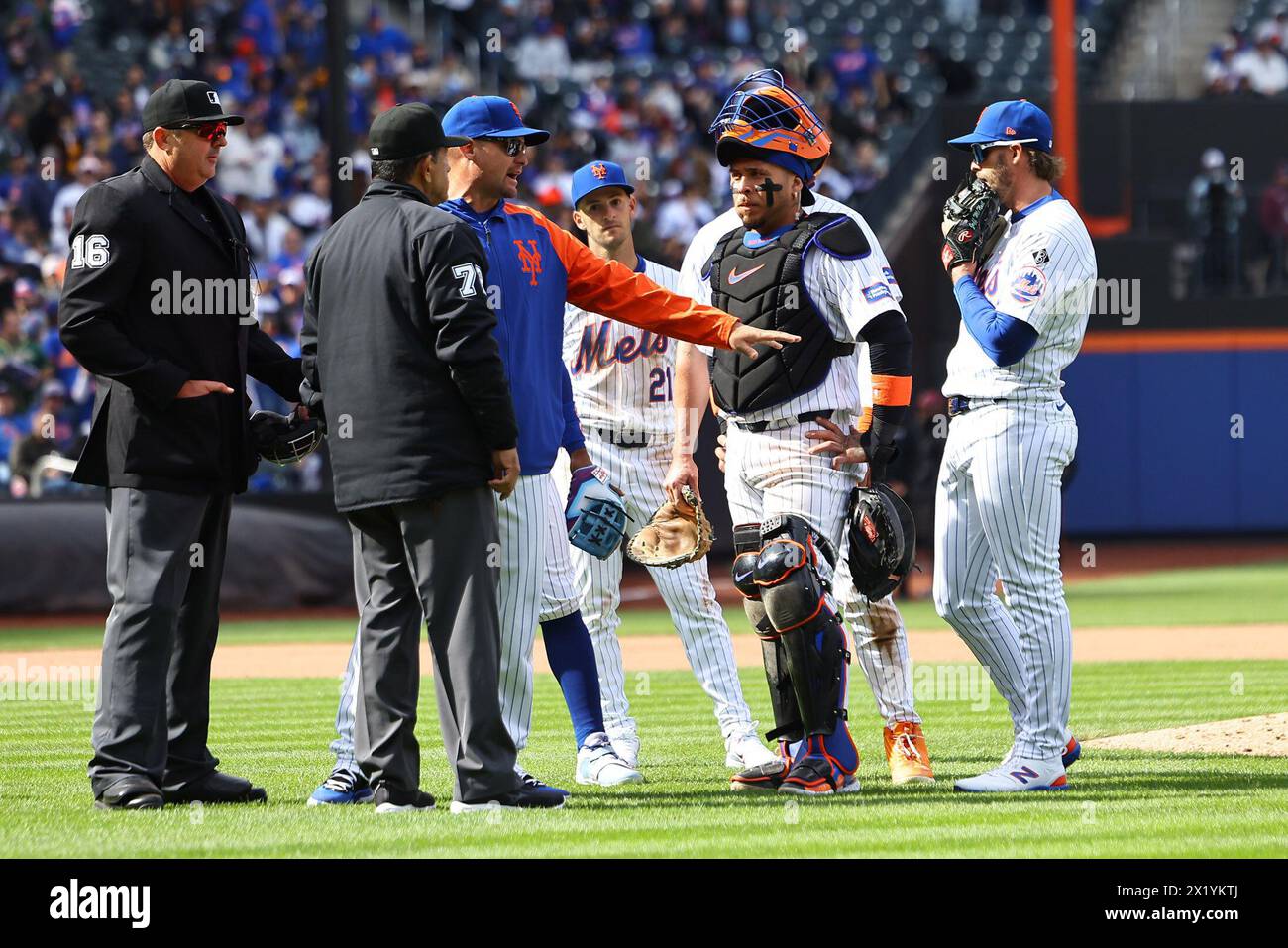 New York Mets manager Carlos Mendoza #64 argues with umpires after ...